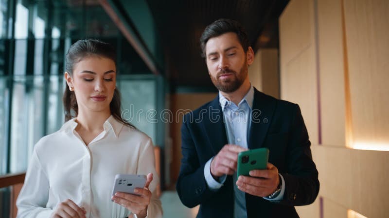 Friendly Colleagues Talking Office Corridor Walking at Work Break ...