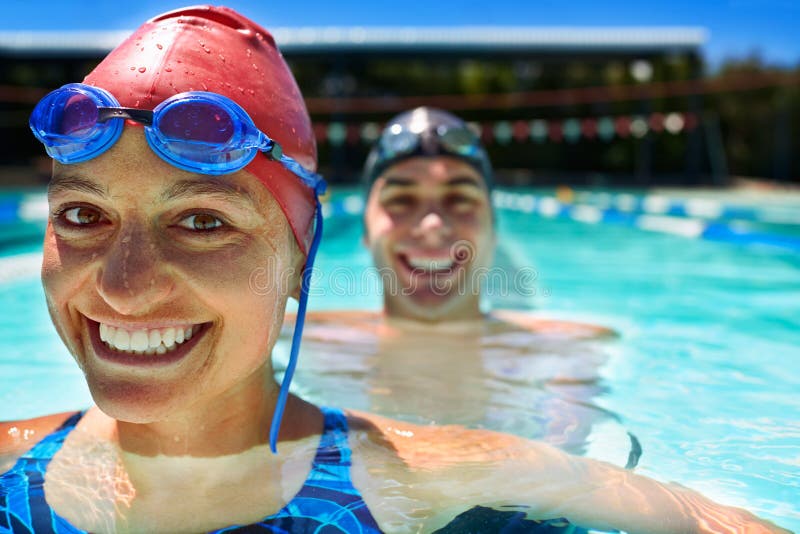 Friendly Competition. Two Swimmer Standing in a Pool Smiling. Stock ...