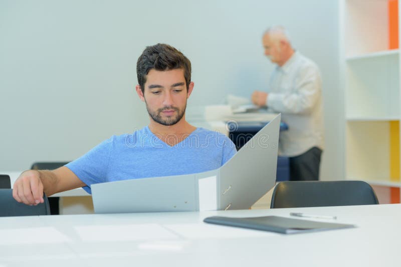 Friendly Confident Post Graduate Student Swith Folder in Classroom ...