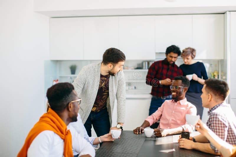 Friendly Conversation among Office Workers Over a Cup of Tea Stock ...