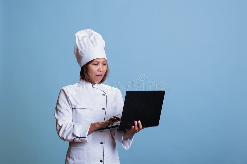 Friendly Cook Browsing Culinary Recipe on Laptop Computer Checking ...
