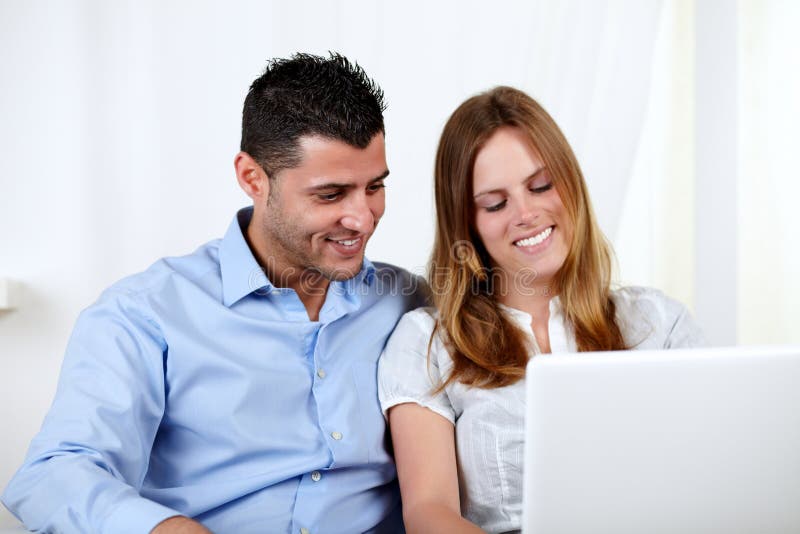 Friendly Couple Using a Laptop Stock Image - Image of laptop, cute ...