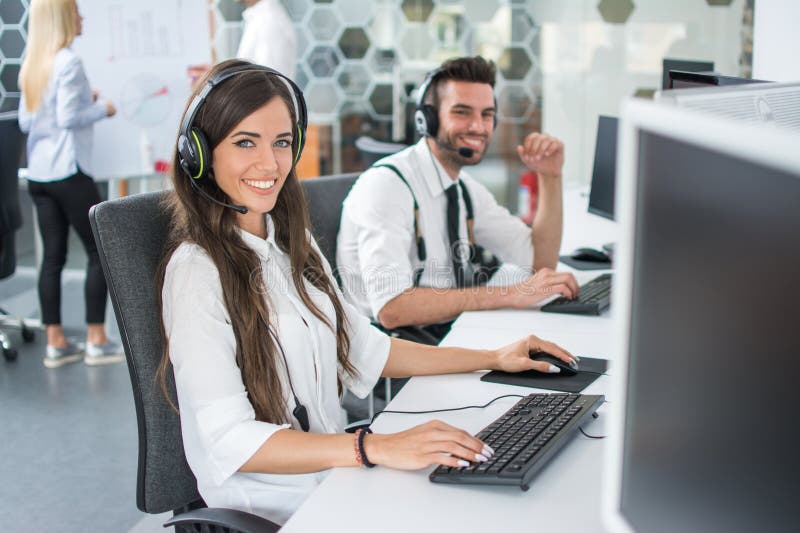 Friendly Customer Service Agents Working in Call Center. Stock Photo ...