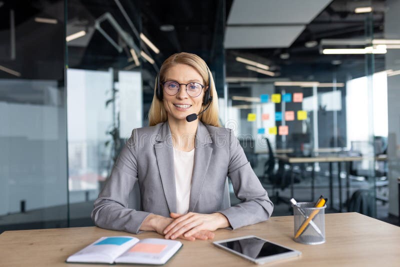A Friendly Customer Service Representative Wearing a Headset in a ...