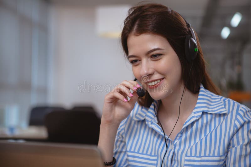Friendly Customer Support Operator with Headset Working at Call Center ...