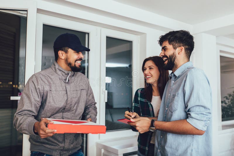 Delivery Man Handing Pizza To a Customer Stock Photo - Image of dinner ...