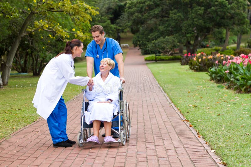 Friendly Doctor Greeting Patient Stock Photo - Image of garden ...