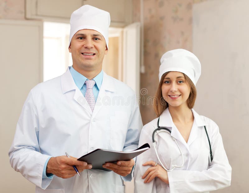 Friendly Doctors in Clinic Interior Stock Photo - Image of intern ...