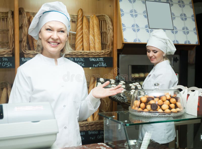 Friendly Female Bakers with Pastry Smiling in Bakery Stock Photo ...