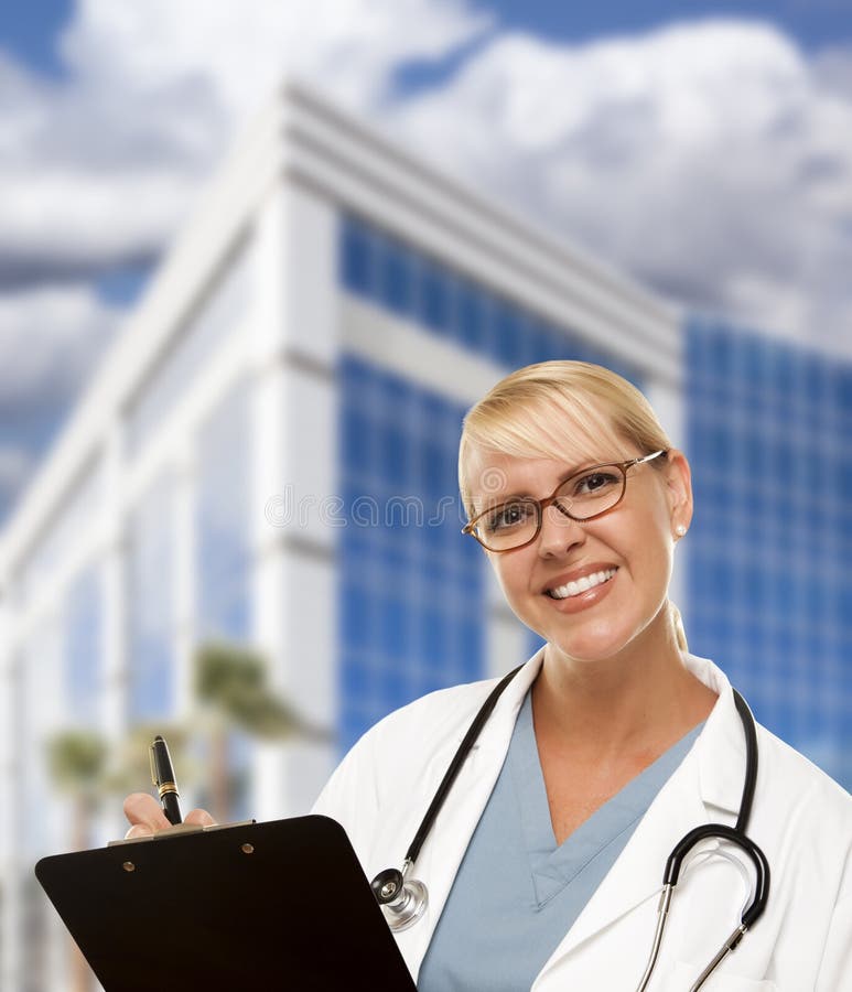 Friendly Female Blonde Doctor or Nurse in Front of Building Stock Image ...