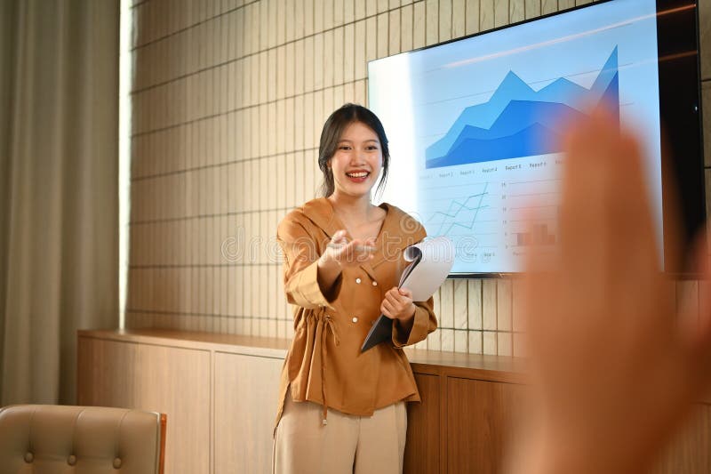 Friendly Female Manager Asking Question, Interacting with Team at ...