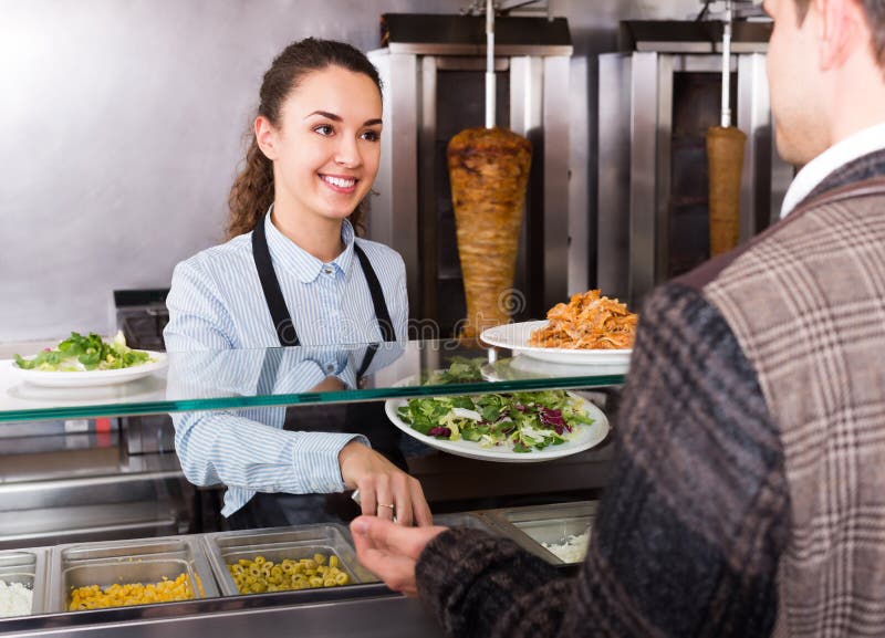 Friendly Female Worker Serving Customer Stock Photo - Image of ...