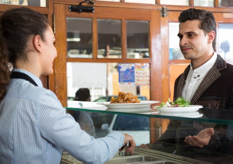 Friendly Female Worker Serving Customer with Smile Stock Image - Image ...