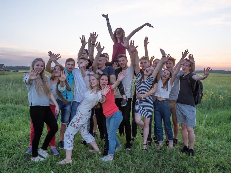 Friendly Friends Posing Outdoors in the Evening. Stock Image - Image of ...