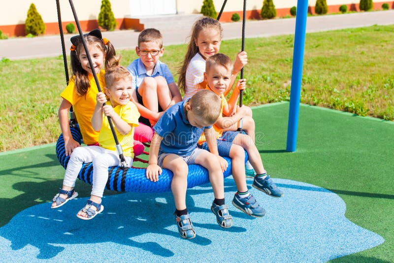 Friendly Group on the Swing in the Summer Outdoors Stock Photo - Image ...