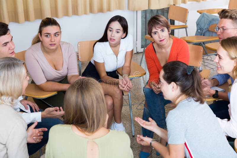 Group of Students Studying with Female Tutor Stock Photo - Image of ...
