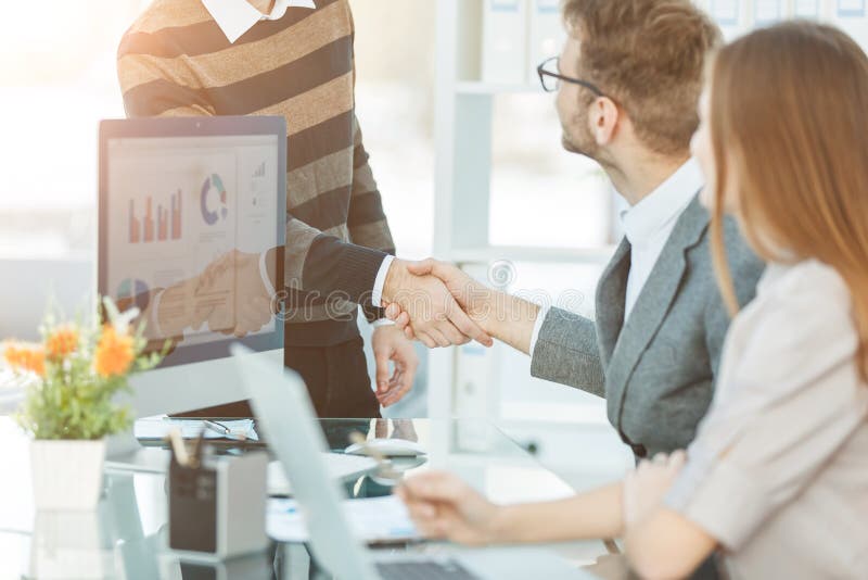 Friendly Handshake of Employees in the Workplace at the Beginning Stock ...