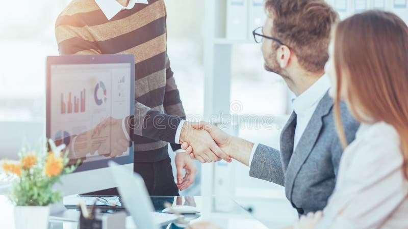 Friendly Handshake of Employees in the Workplace at the Beginning Stock ...