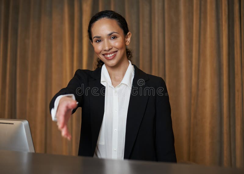 Friendly Hotel Receptionist Extending a Handshake in a Professional ...