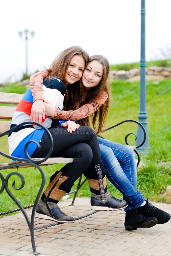 Friendly hug stock photo. Image of girl, bench, help - 29442984