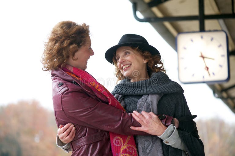 Friendly Hug at Train Station Stock Image - Image of outdoor, friends ...