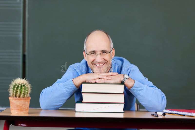 Friendly Male Teacher Relaxing Stock Photo - Image of educating, board ...