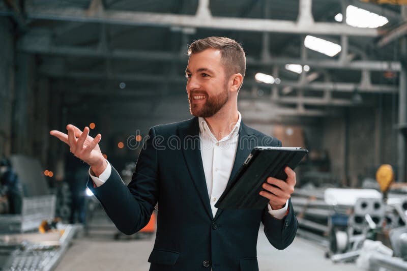 Friendly Manager in Black Formal Wear at the Factory Stock Photo ...