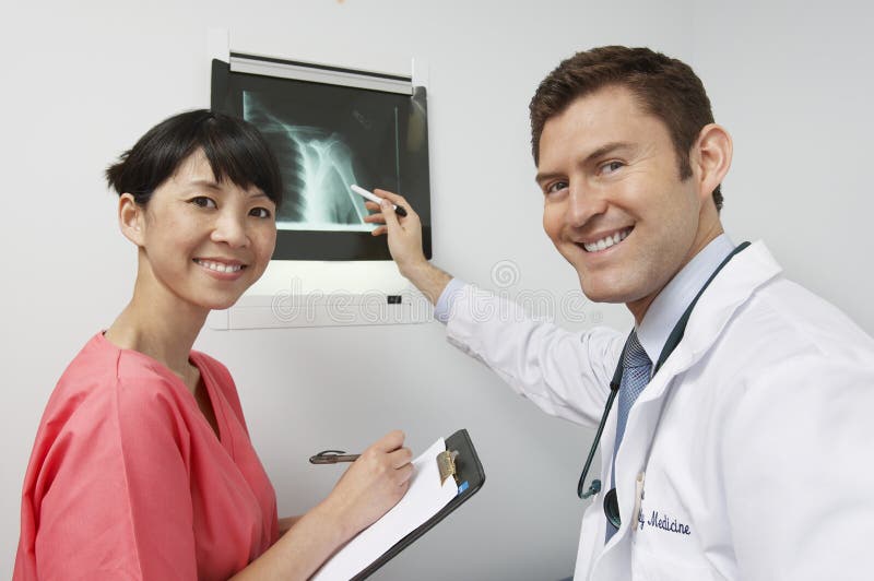 Friendly Medical Staff Members with X-Ray Results Stock Image - Image ...