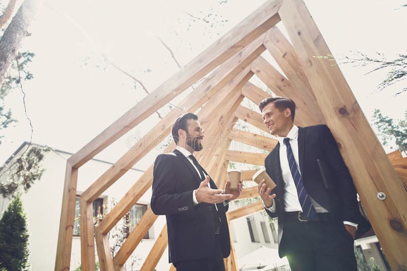 Friendly Men Drinking Coffee Outdoors and Talking Stock Image - Image ...