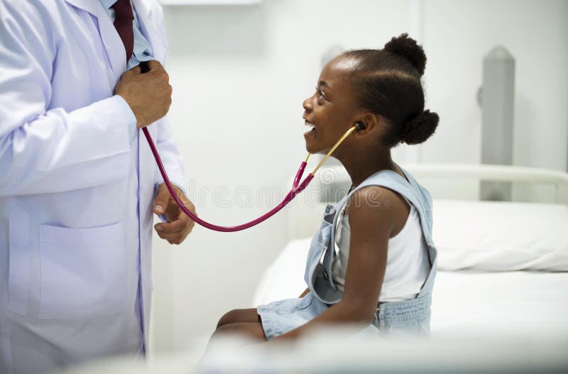 Friendly Pediatrician Entertaining His Patient Stock Photo - Image of ...