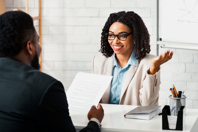 Friendly Personnel Manager Interviewing Black Candidate during Job ...
