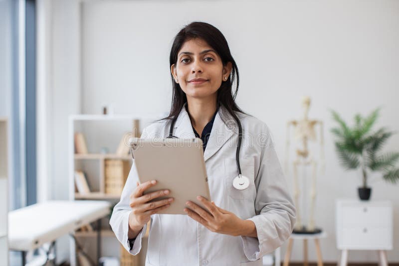 Friendly Physician Holding Digital Tablet in Hospital Room Stock Photo ...