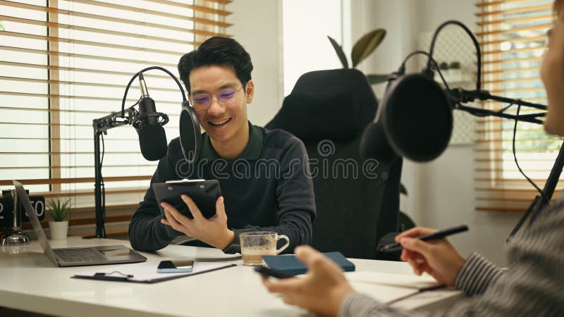 Friendly Radio Host Using Condenser Microphone for Recording Voice Over ...