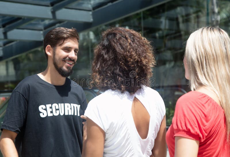 Friendly Security Guard Checking People at the Entrance Stock Image ...