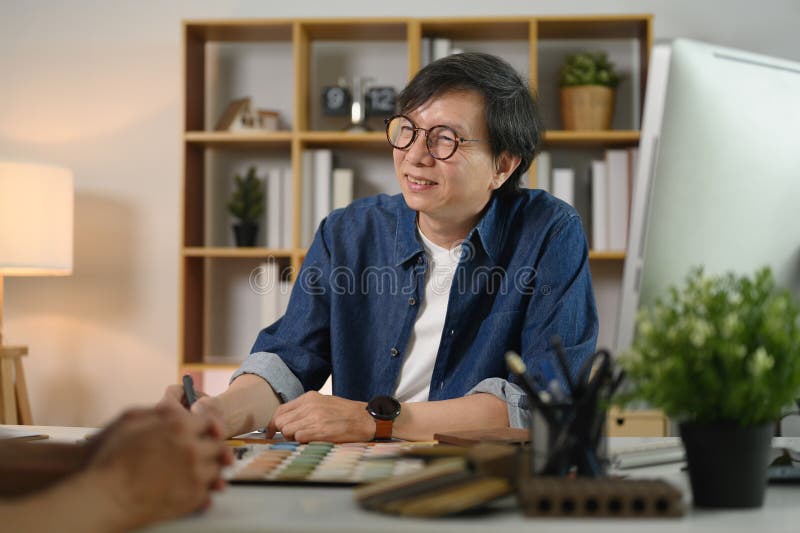 Friendly Senior Male Designer Expert Helping His Client Matching ...