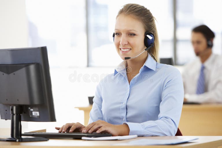 Friendly Service Agent Talking To Customer in Call Centre Stock Photo ...