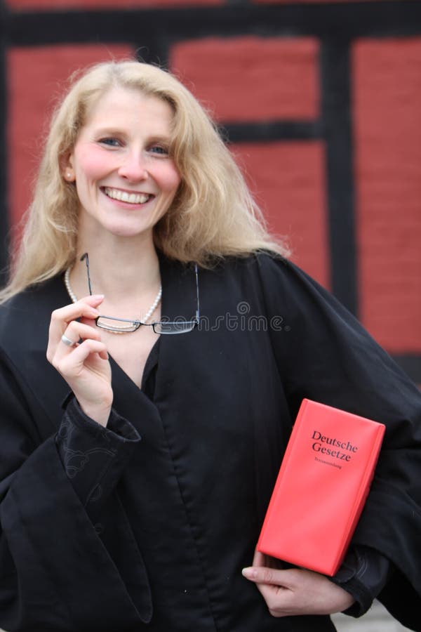 Friendly Smiling Lawyer with Red Law Book Under H Stock Photo - Image ...