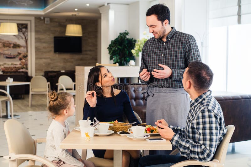 Friendly Smiling Waiter Taking Order Table Family Having Dinner ...