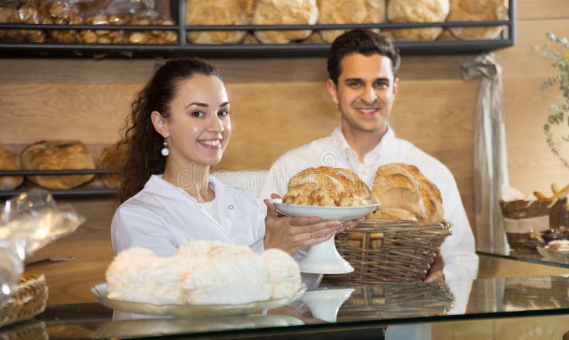 Friendly Staff and Young Woman Client at Counter Stock Photo - Image of ...