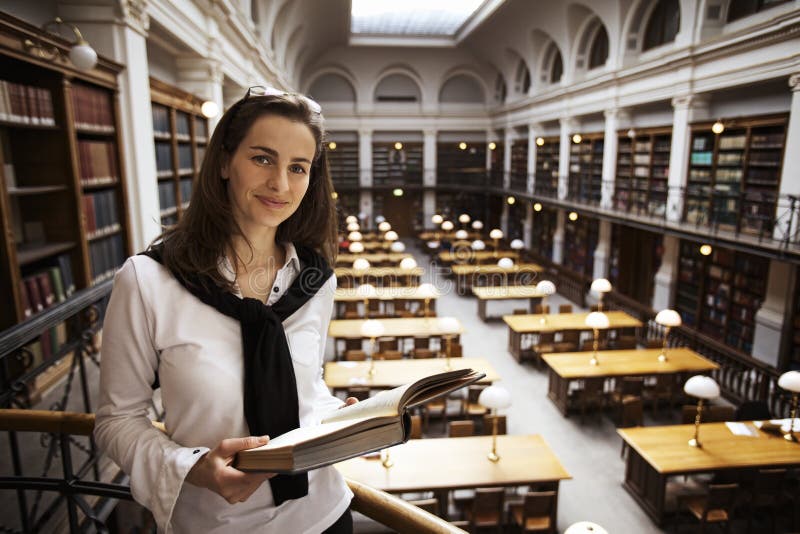 Friendly Student Reading in Library Upstairs. Stock Image - Image of ...
