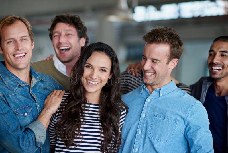 Friendly and Supportive Staff. a Smiling Group of Coworkers Standing in ...