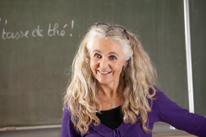 Teacher Holding Text Book Pointing To Student Stock Image - Image of ...