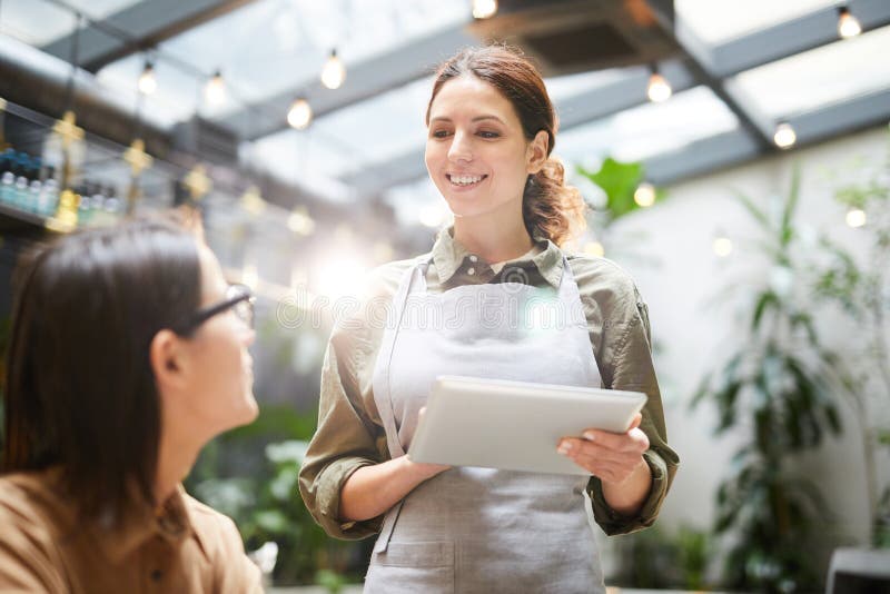 Friendly Waitress Using Tablet To Take Order Stock Image - Image of ...