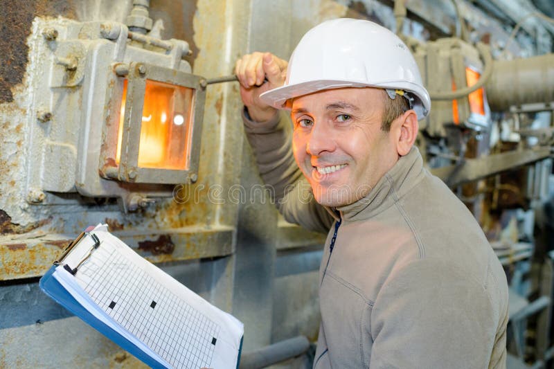 Friendly Worker with Fire in Factory Stock Photo - Image of ...