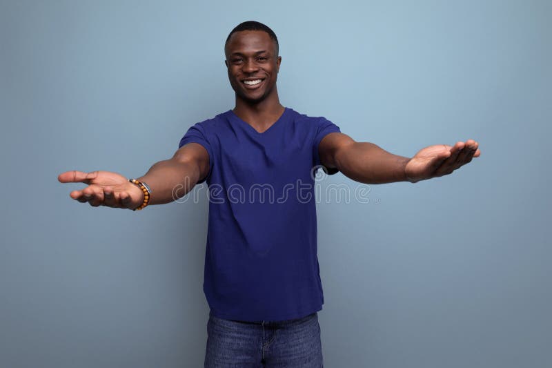 Friendly Young American Man in Blue T-shirt with Open Arms Stock Photo ...