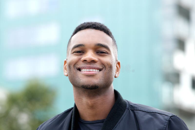 Friendly Young Man Smiling Outdoors Stock Photo - Image of expression ...