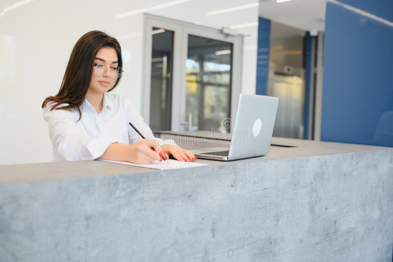 Friendly Young Woman Behind the Reception Desk Administrator Stock ...