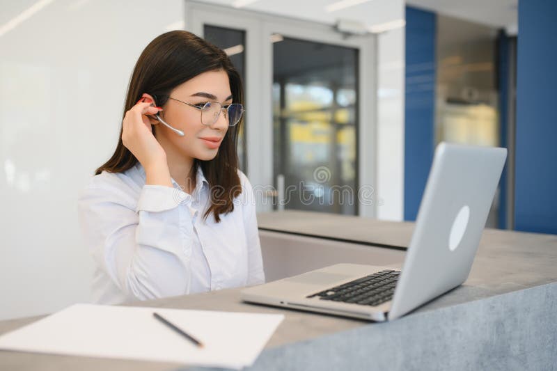 Friendly Young Woman Behind the Reception Desk Administrator Stock ...