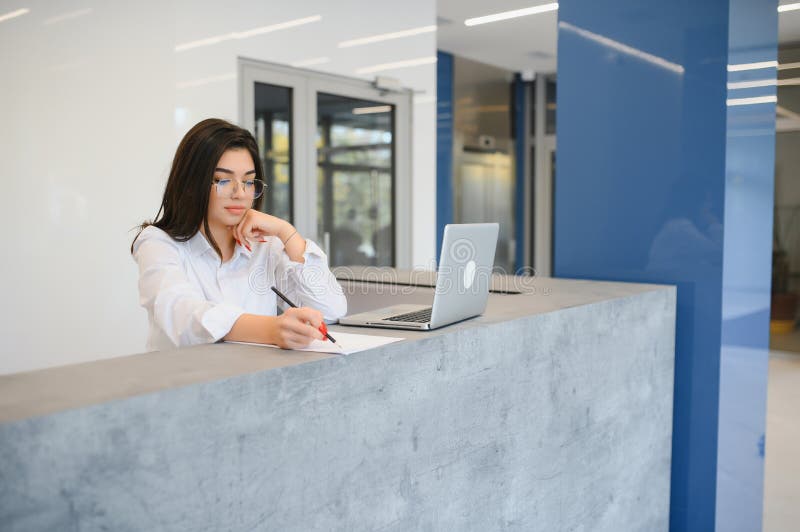 Friendly Young Woman Behind the Reception Desk Administrator Stock ...