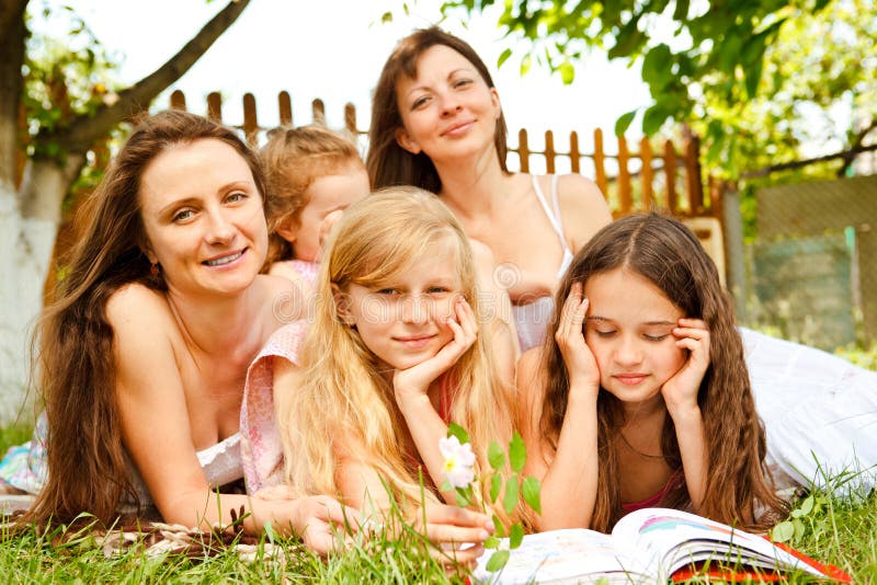 Friends in the backyard stock image. Image of lying, generation - 20016939